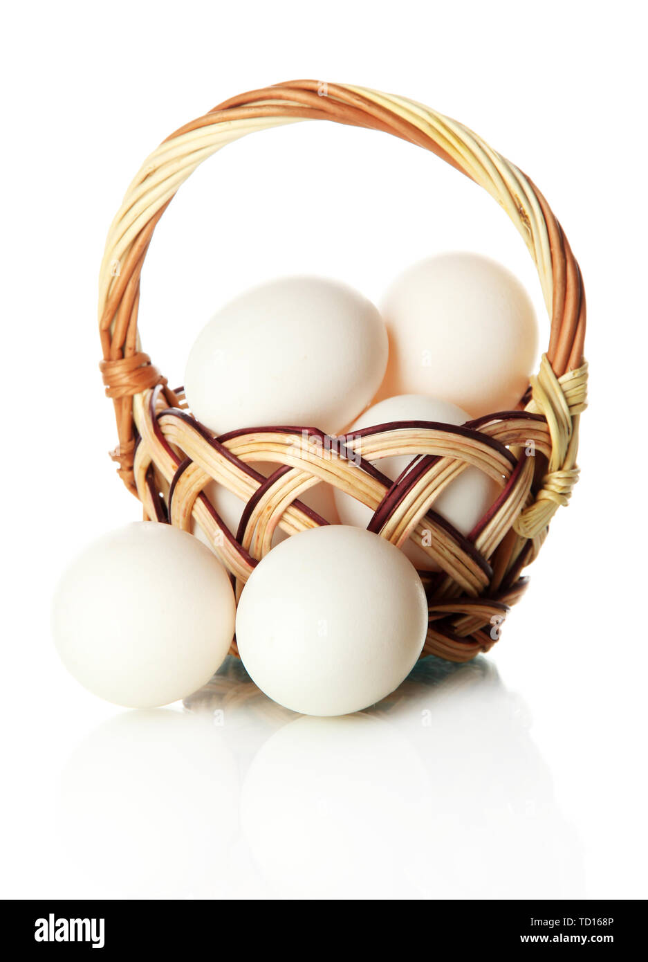Many eggs in basket isolated on white Stock Photo - Alamy