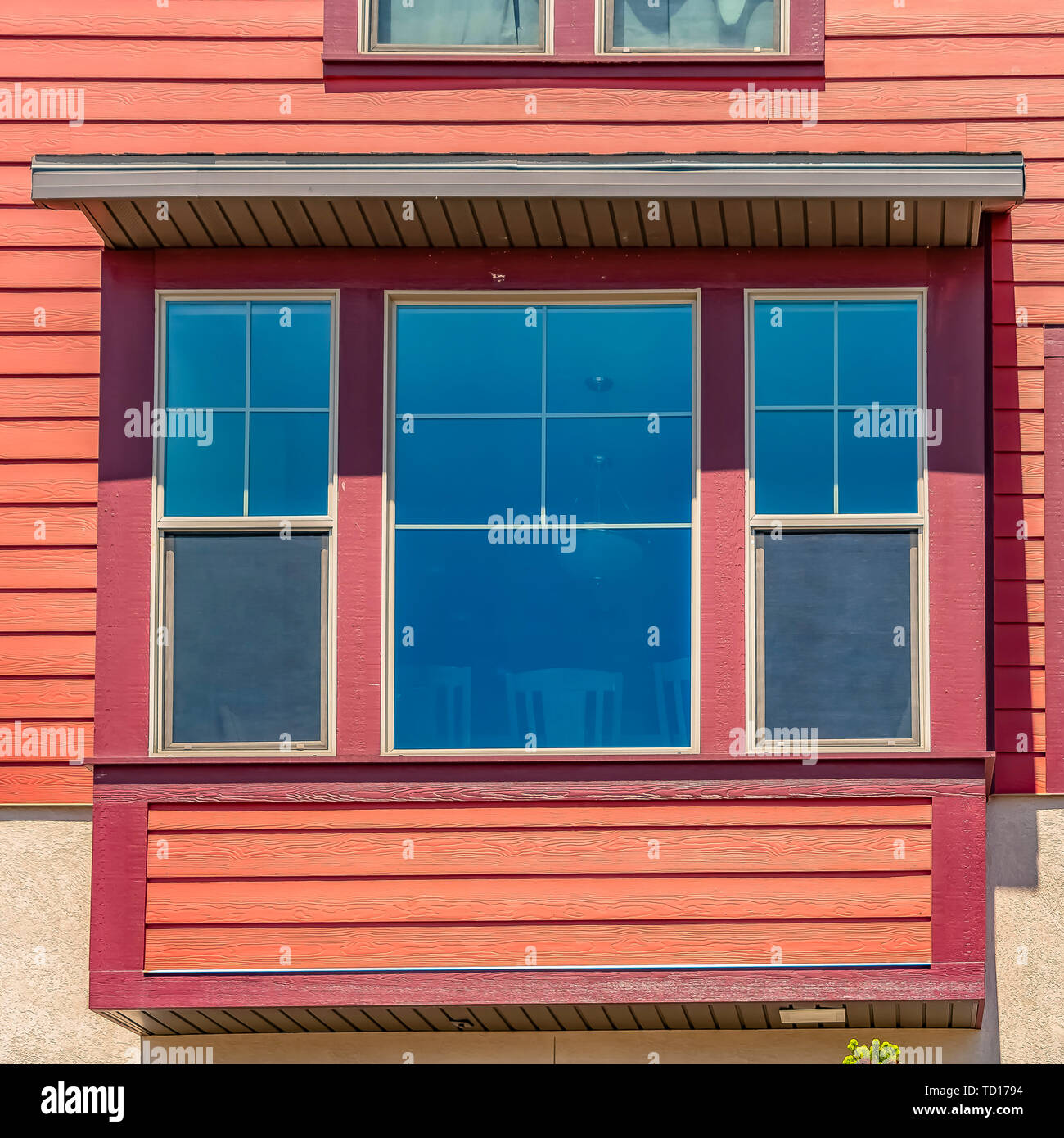 Square frame Window of a home with combination of wood section and ...