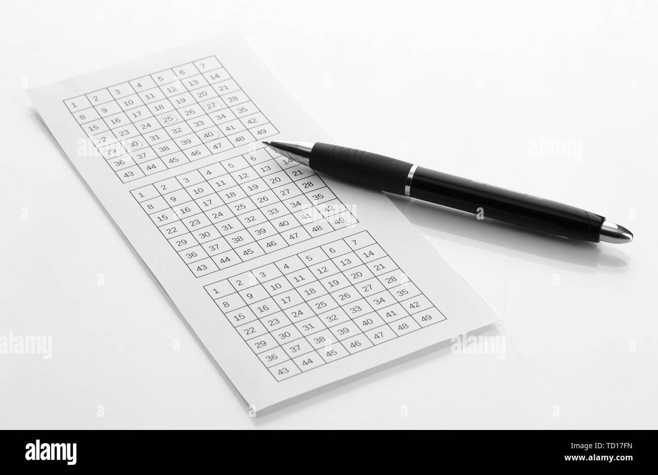 Lottery ticket and pen, isolated on white Stock Photo - Alamy