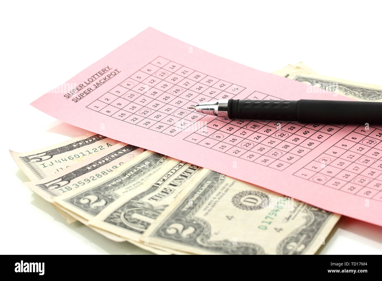 Lottery ticket with pen and money, isolated on white Stock Photo - Alamy