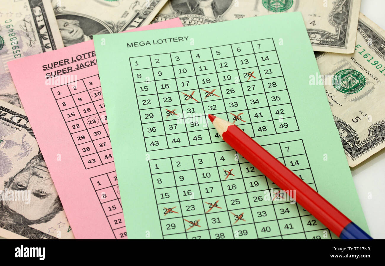 Lottery ticket with pencil and money, isolated on white Stock Photo - Alamy