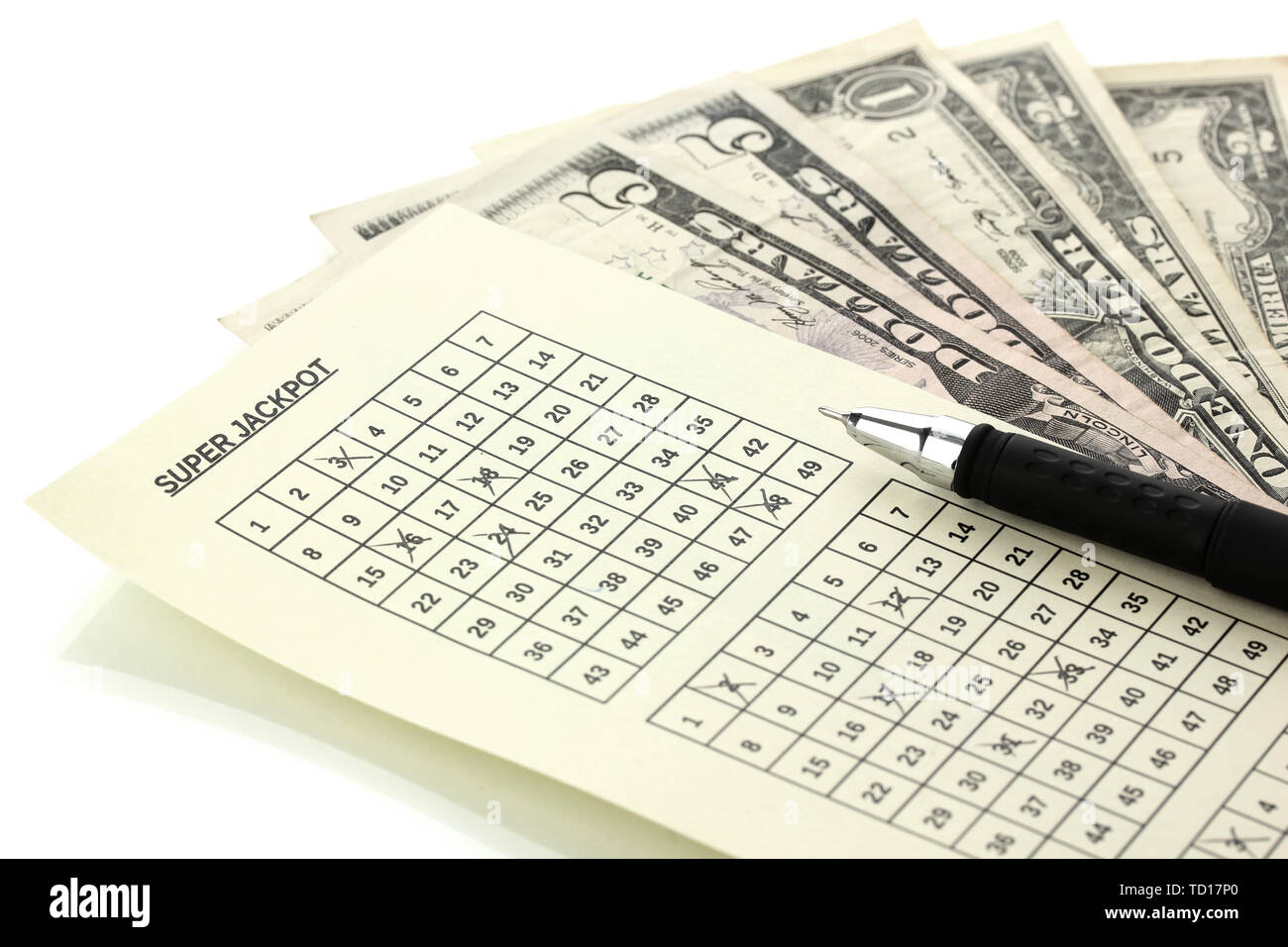 Lottery ticket with pen and money, isolated on white Stock Photo - Alamy