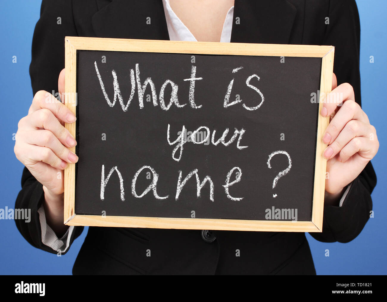 Young woman holding sign What Stock Photo - Alamy