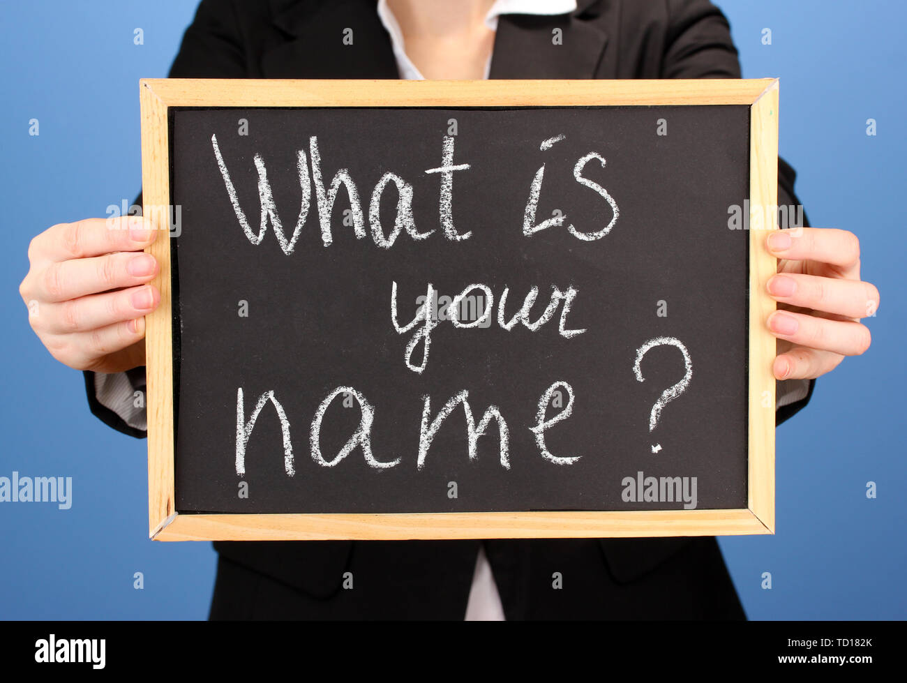 Young woman holding sign What Stock Photo - Alamy