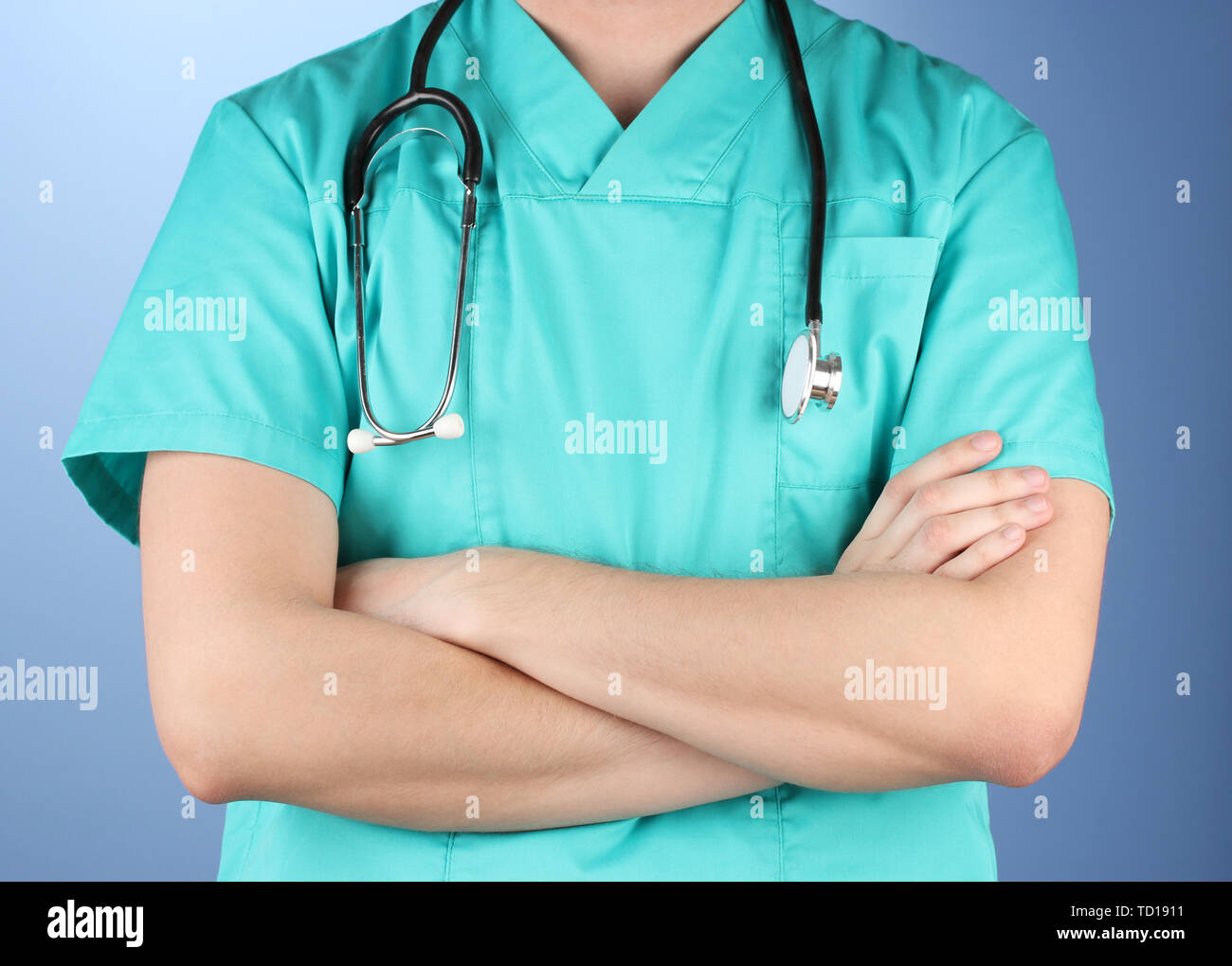 Doctor with stethoscope, on blue background Stock Photo - Alamy
