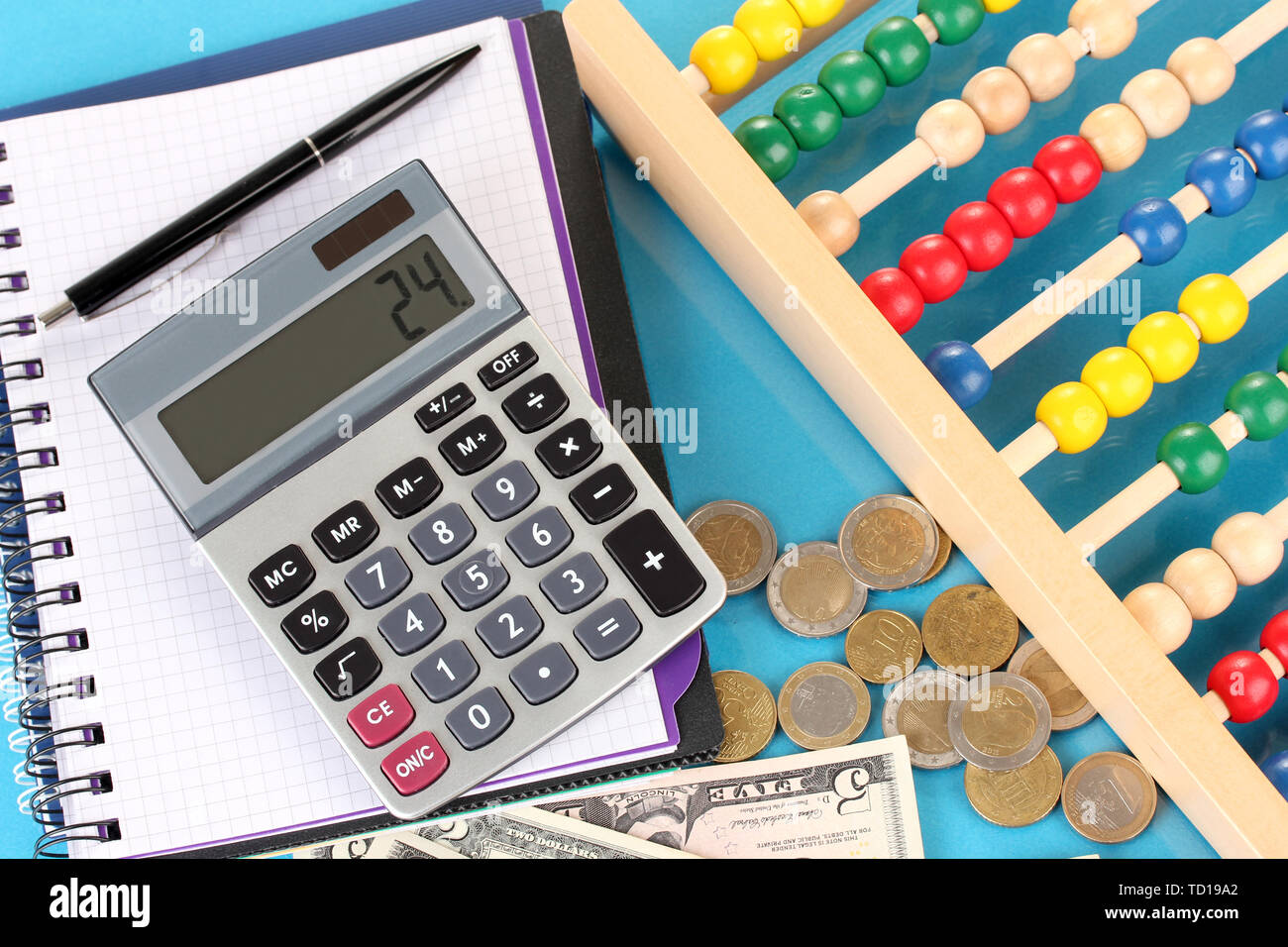 Bright wooden abacus and calculator. Conceptual photo of old and modern ...