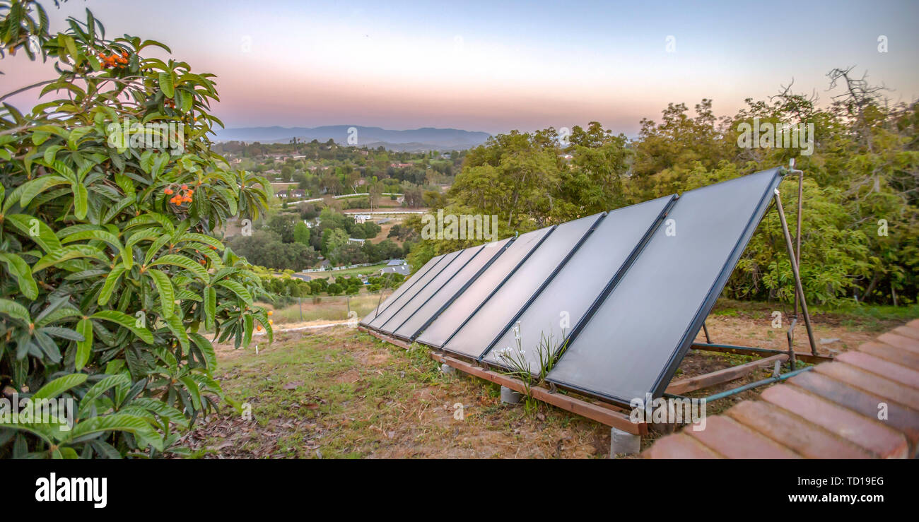 Solar panel on ground with mountain and sky view Stock Photo - Alamy