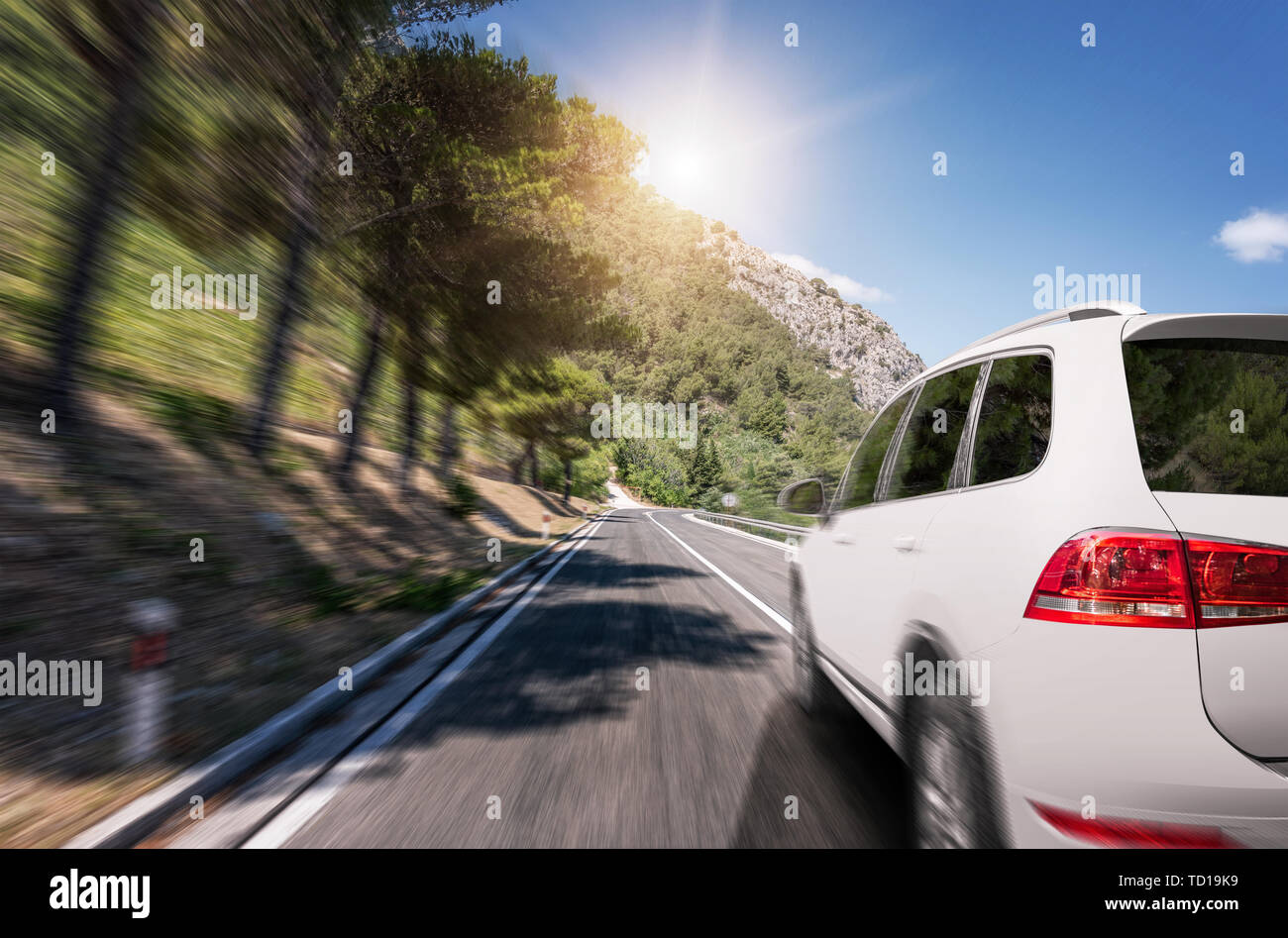 White car rushing along a high-speed highway Stock Photo - Alamy