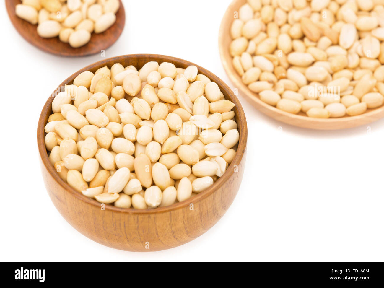 Peeling peanuts on white background Stock Photo - Alamy