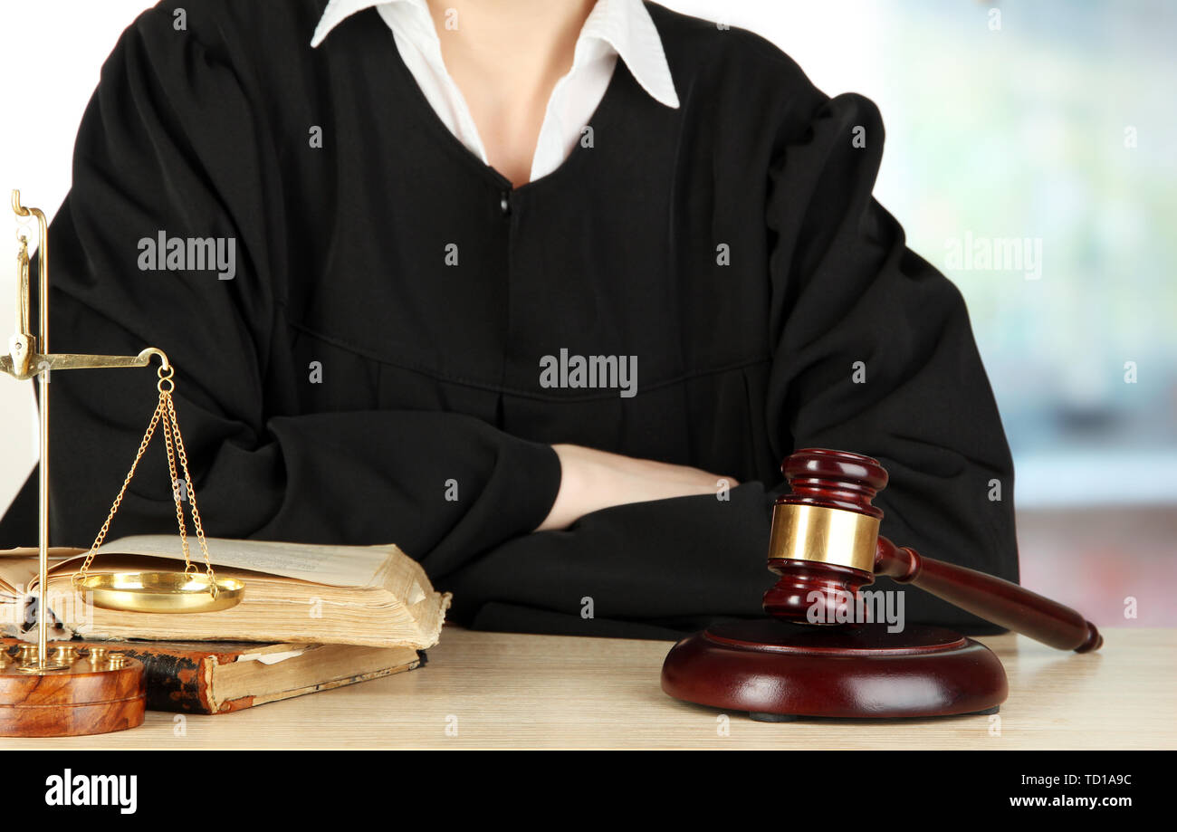 Judge sitting at table during court hearings on room background Stock ...
