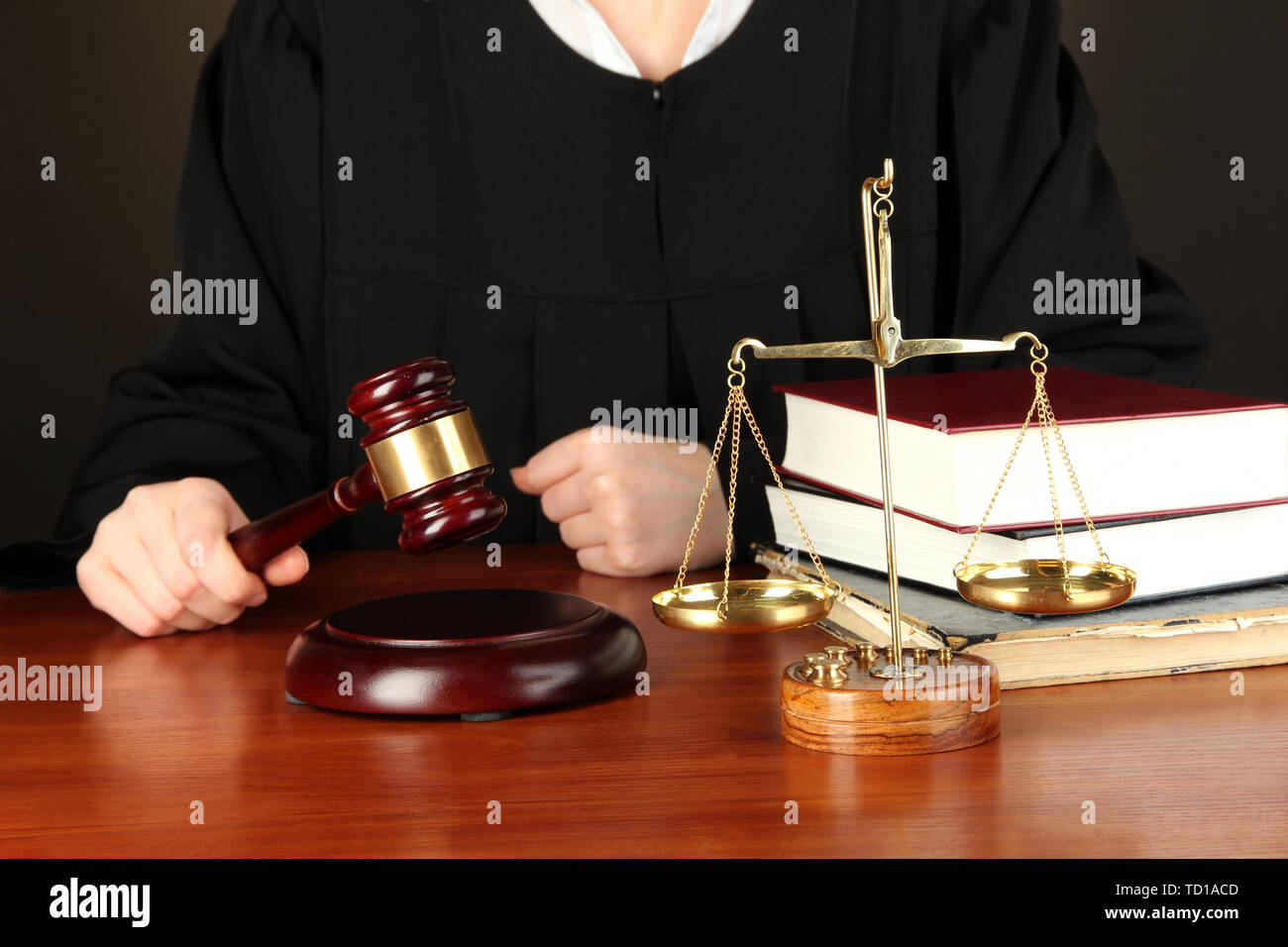 Judge sitting at table during court hearings on black background Stock ...