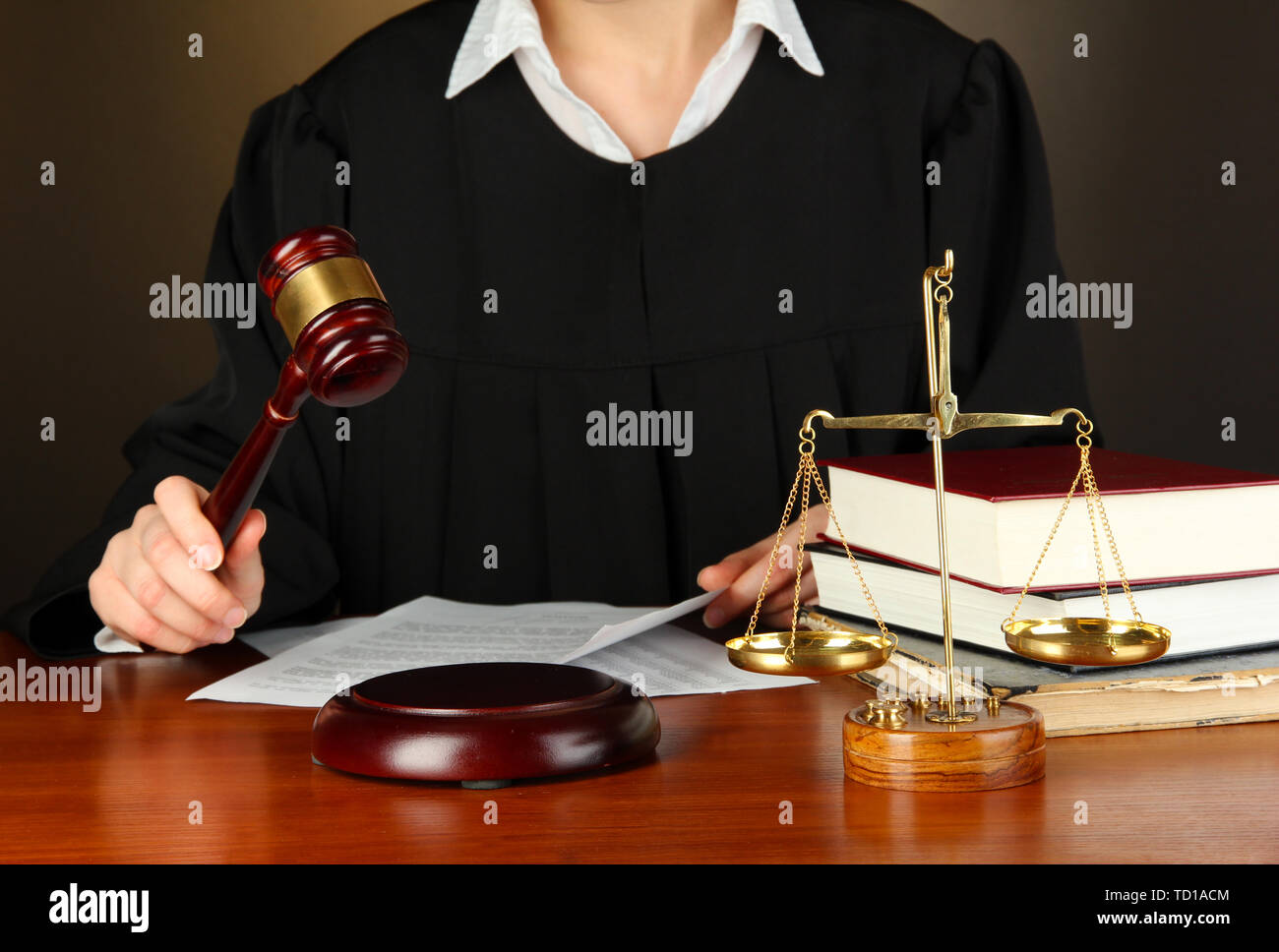 Judge sitting at table during court hearings on black background Stock ...