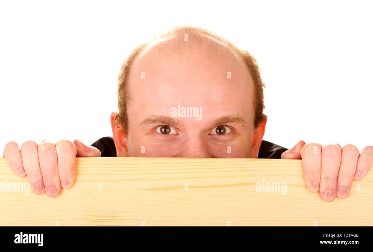 Man peeking from wooden desk, isolated on white Stock Photo - Alamy