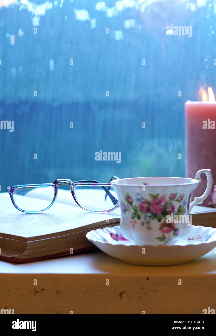 Nostalgia scene relaxing by the window on a cold rainy day with old ...