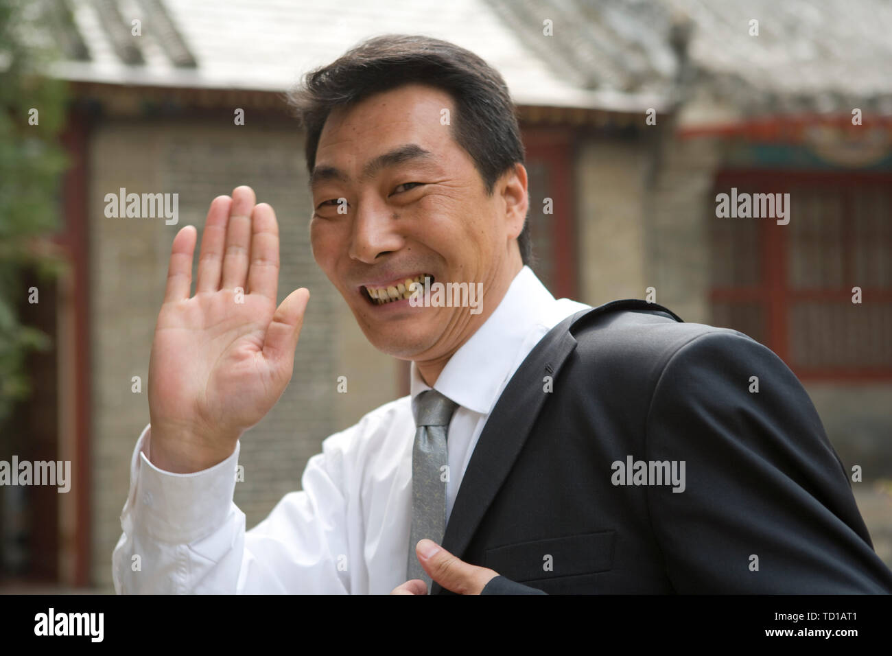 Portrait cheerful businessman waving camera hi-res stock photography ...