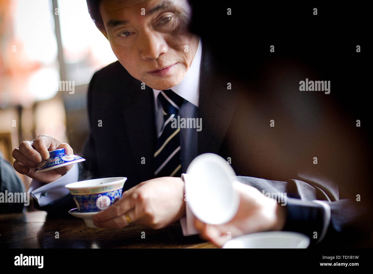 Man sits cafe holding hi-res stock photography and images - Alamy