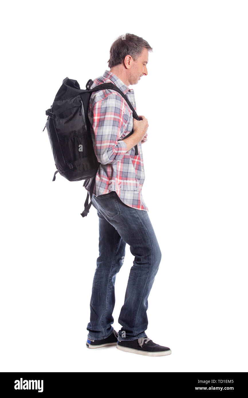 Middle-aged man hiking and carrying a backpack on a white background ...