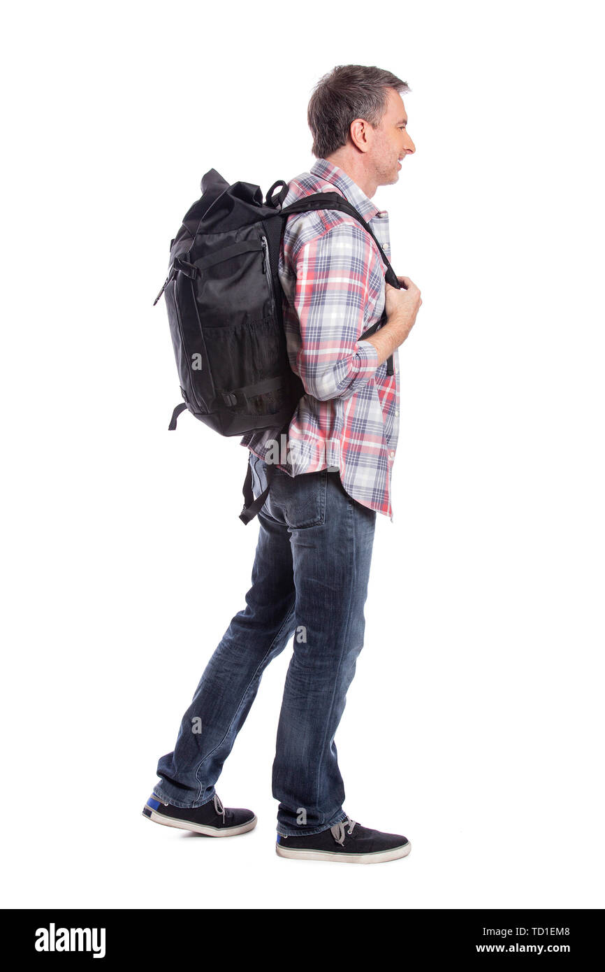 Middle-aged man hiking and carrying a backpack on a white background ...