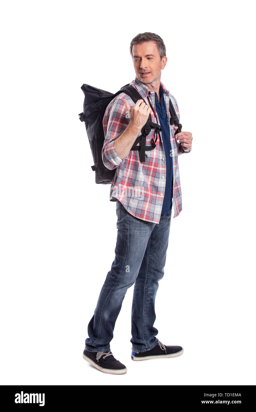 Middle-aged man hiking and carrying a backpack on a white background ...
