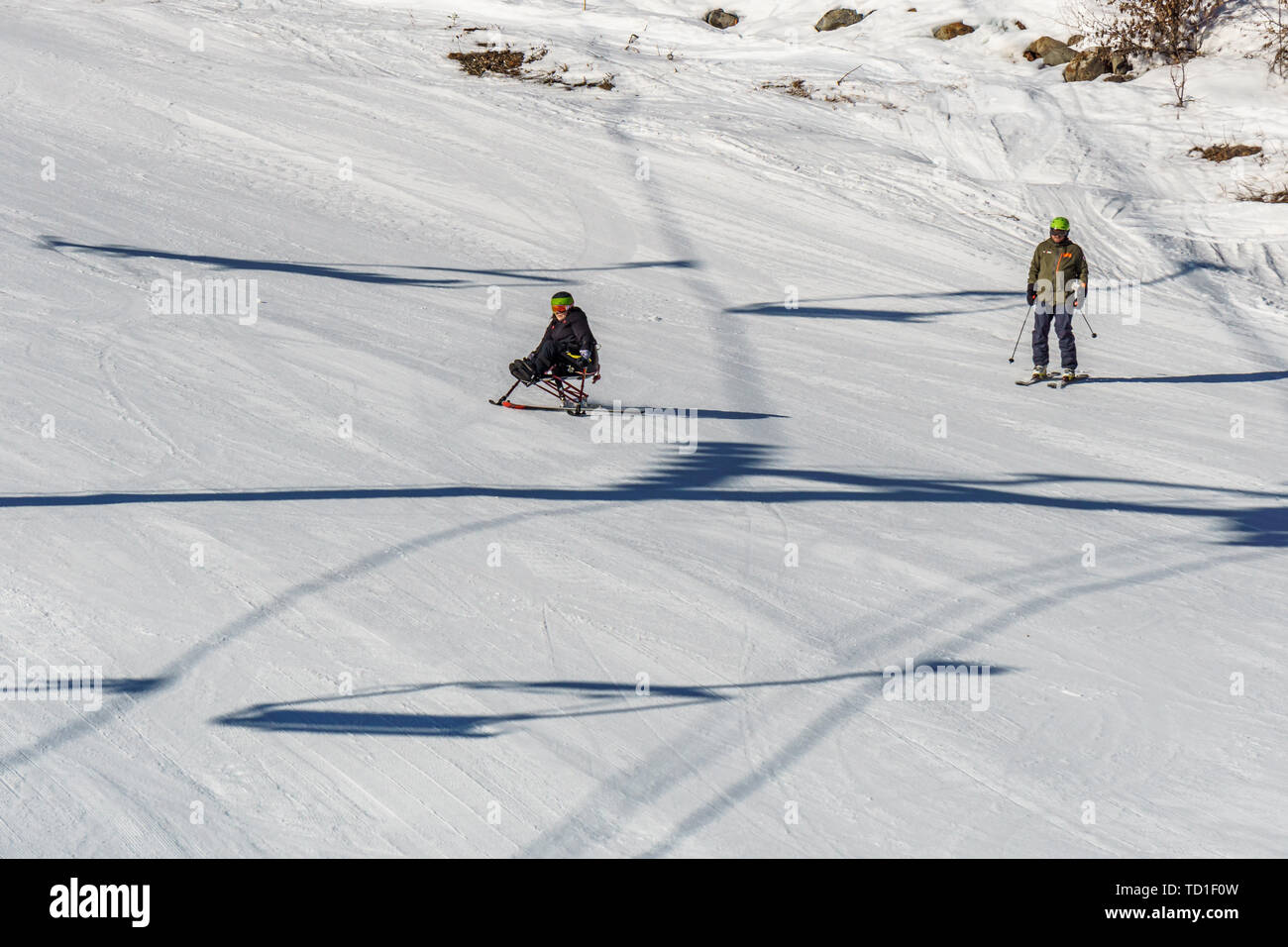 KIMBERLEY, CANADA - MARCH 22, 2019: handicapped person riding a sit ...