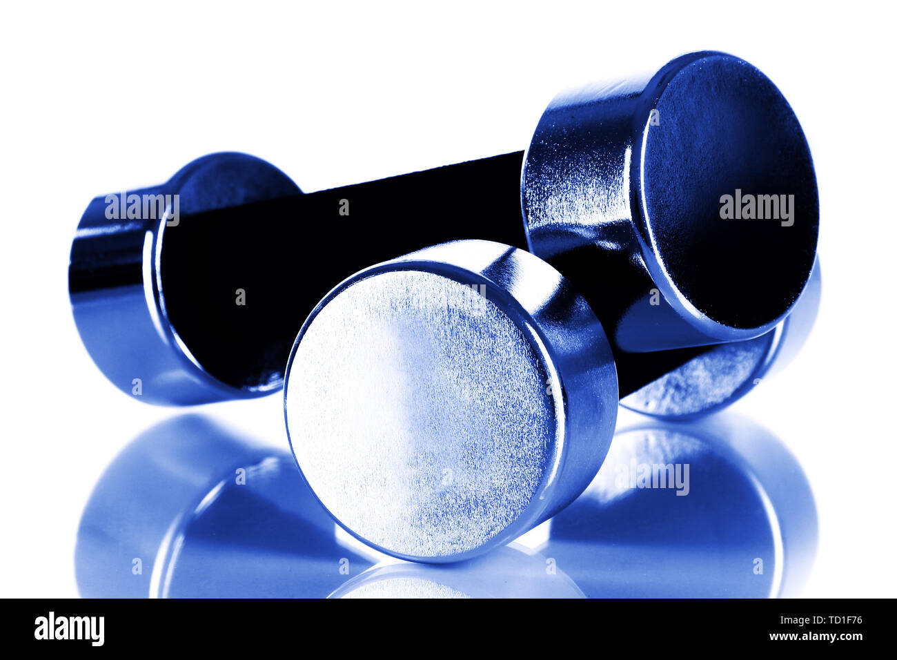 Dumbbells in blue light Stock Photo - Alamy