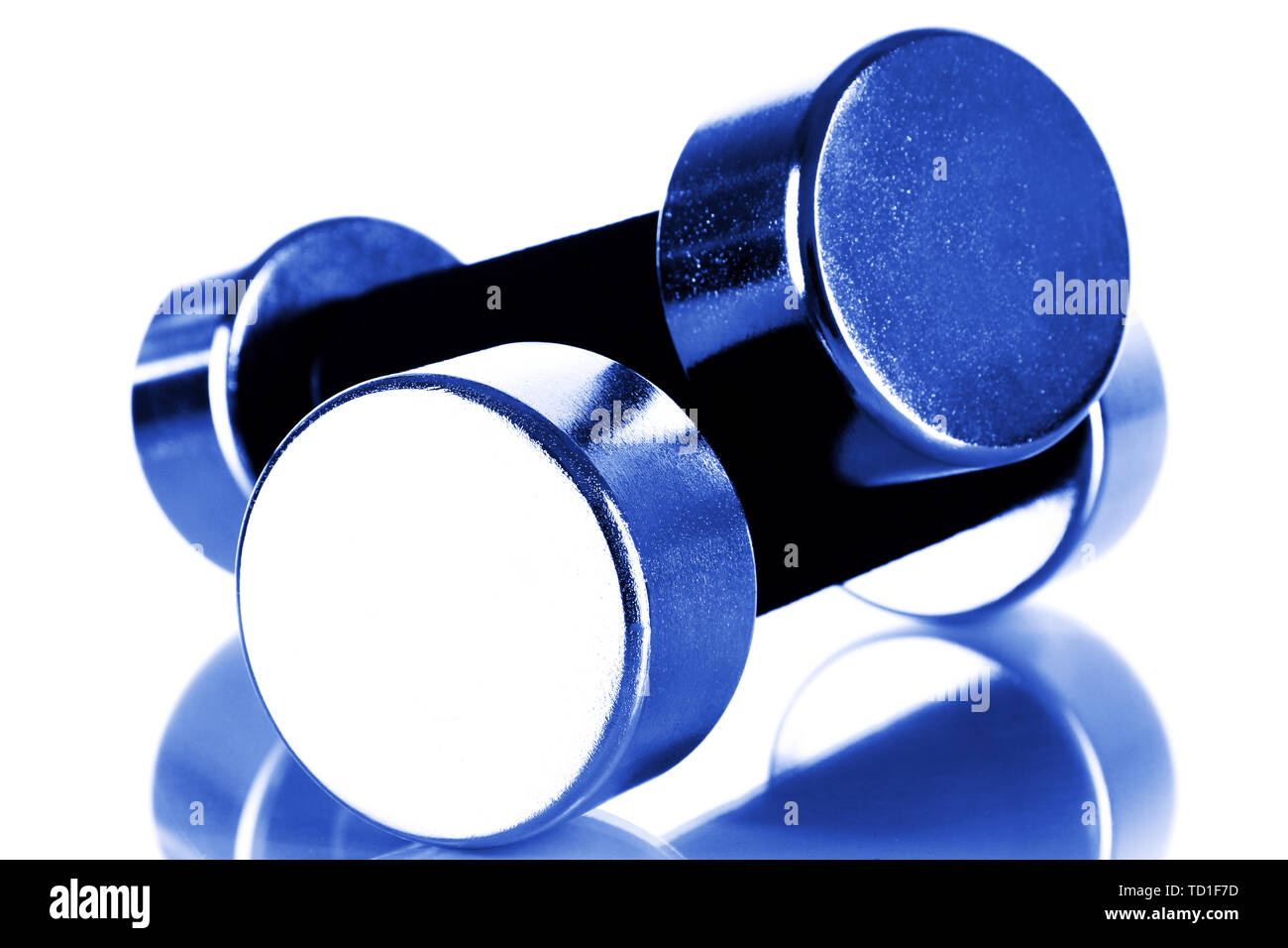Dumbbells in blue light Stock Photo - Alamy