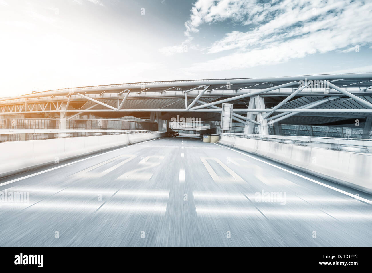 sunlight skyline and road through buildings Stock Photo - Alamy