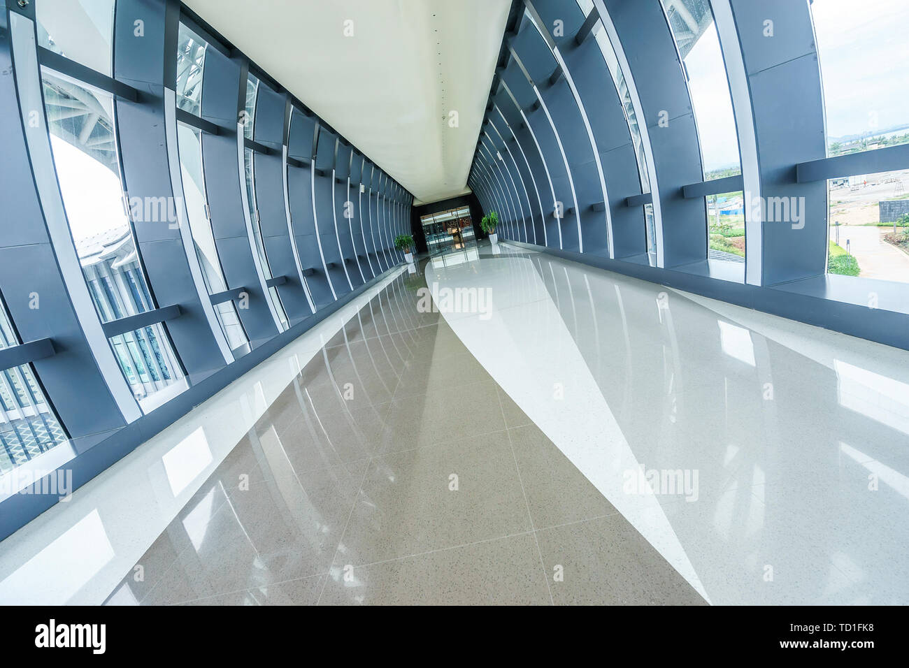 corridor with many glass windows in modern shopping mall Stock Photo ...