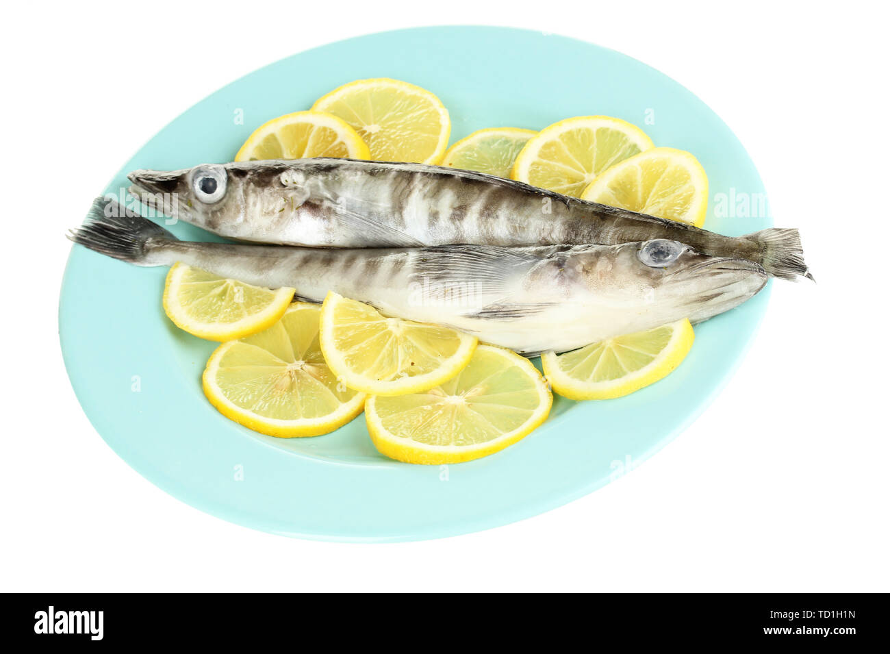 Fresh fish with lemon on plate isolated on white Stock Photo - Alamy