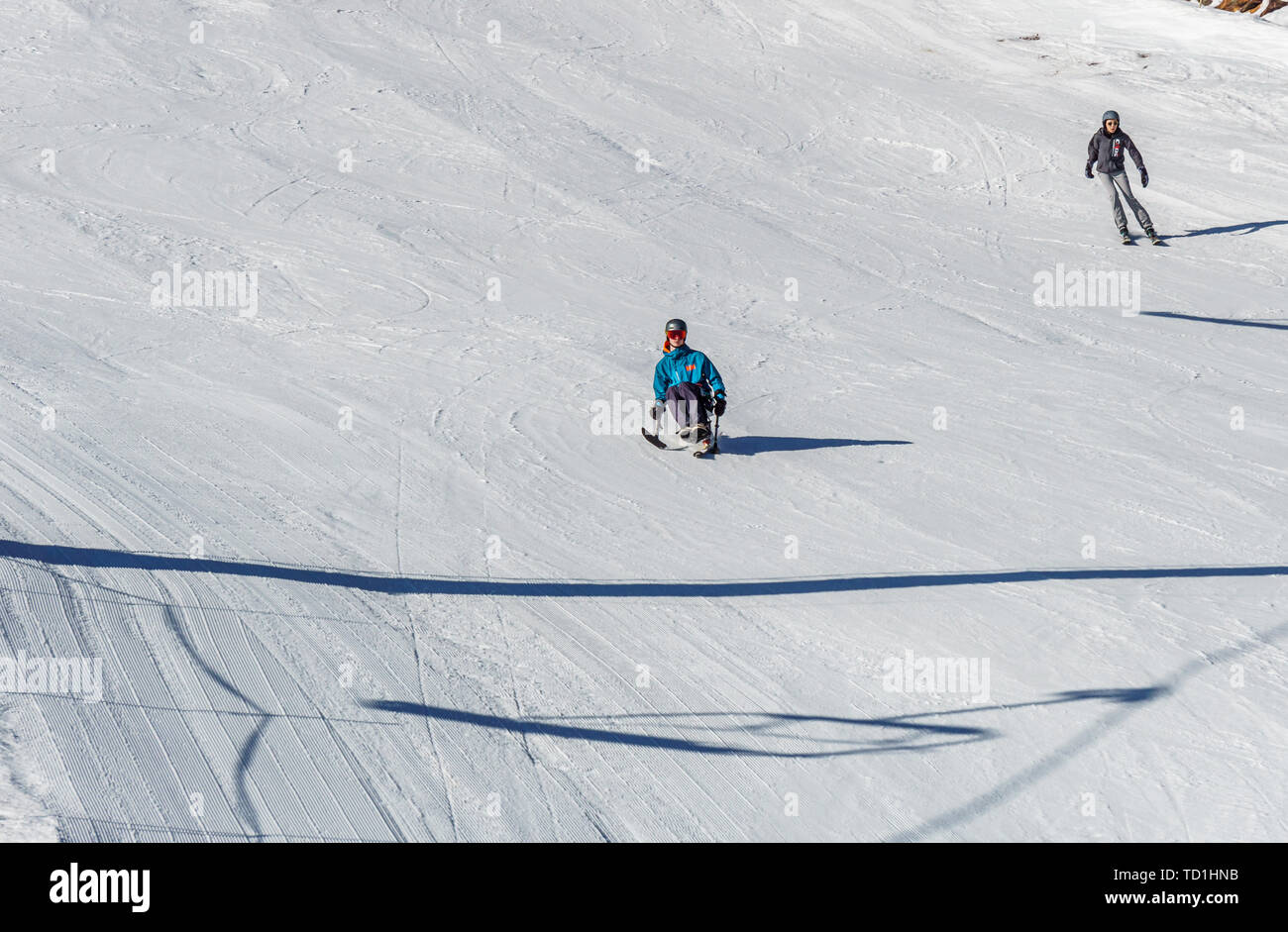 KIMBERLEY, CANADA - MARCH 22, 2019: handicapped person riding a sit ...