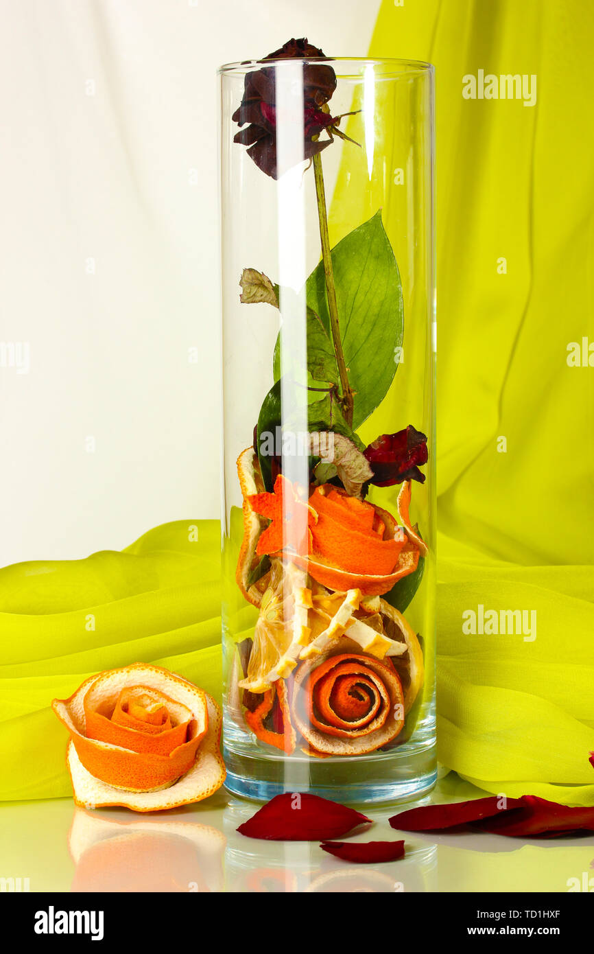 Dried rose in glass vase on white-green fabric background Stock Photo ...