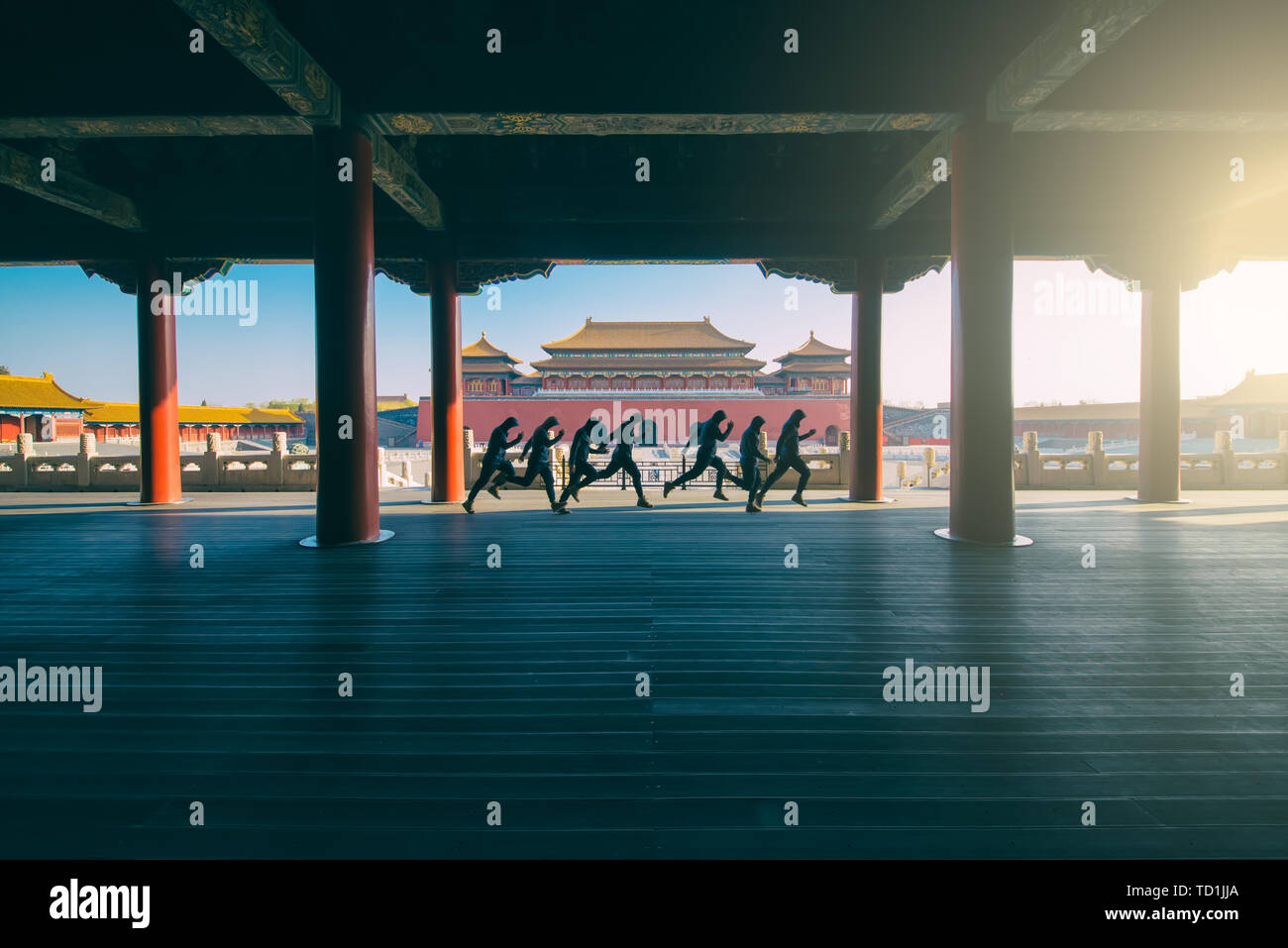 A man running in ancient architecture Stock Photo - Alamy