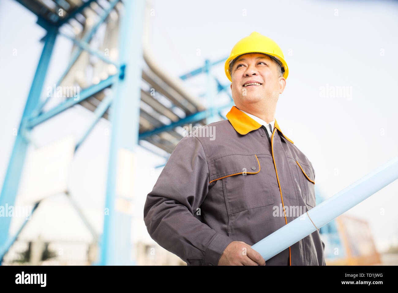 old chinese man engineer in oil refinery plant Stock Photo - Alamy