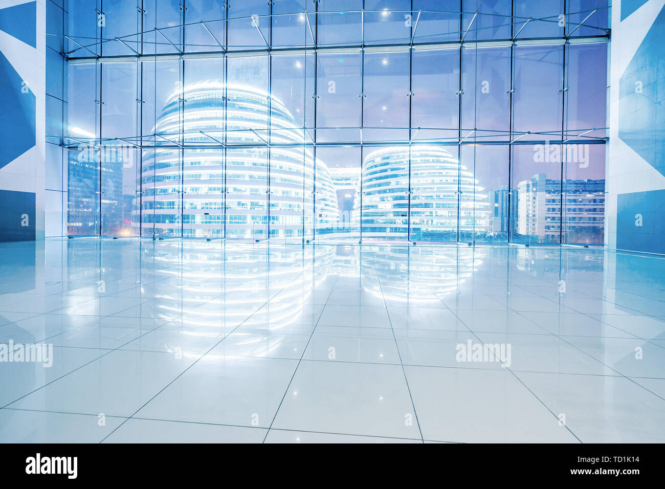 night scene of modern buildings through windows Stock Photo - Alamy
