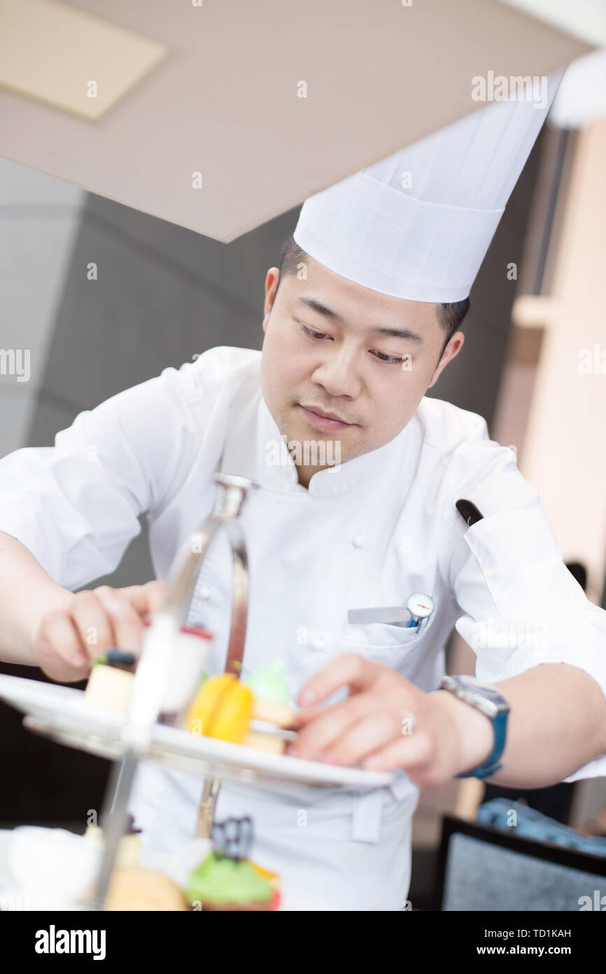 Worker chinese chef standing hi-res stock photography and images - Alamy