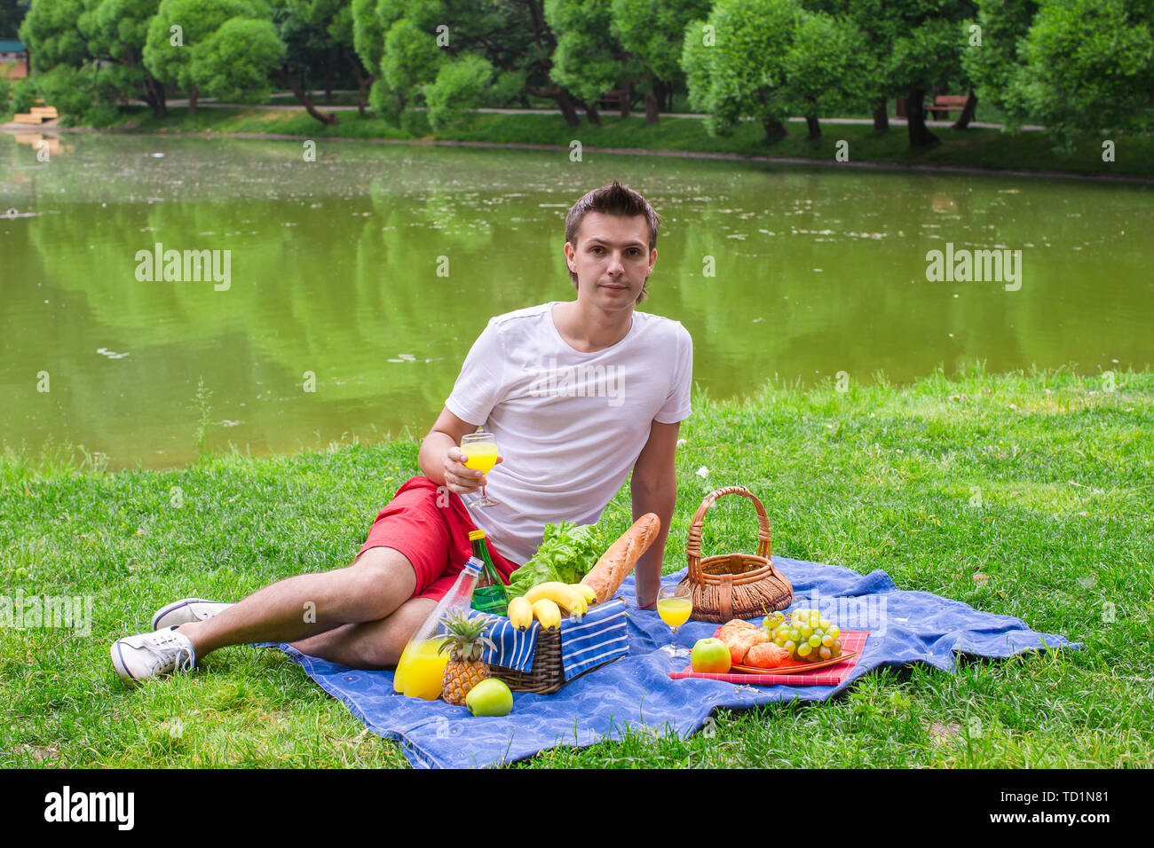 Young happy man in love on a picnic outdoors Stock Photo - Alamy