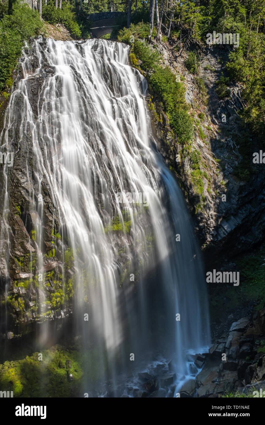 A large drop waterfall photographed on a long exposure to create ...