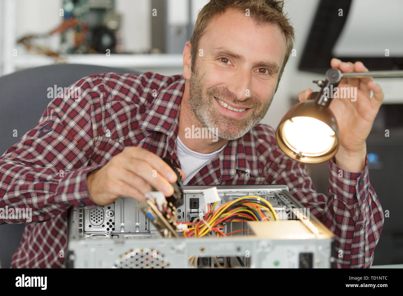 happy man fixing pc Stock Photo - Alamy