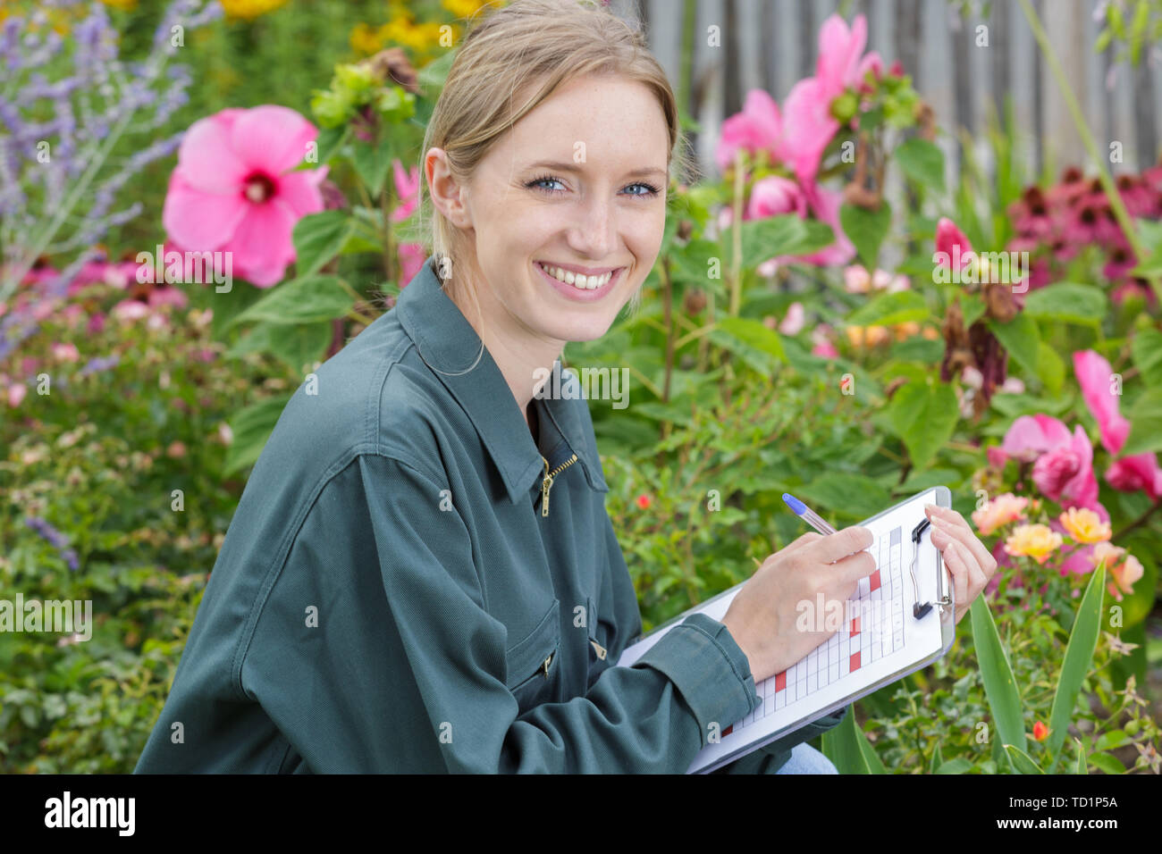 happy woman gardener at work Stock Photo - Alamy