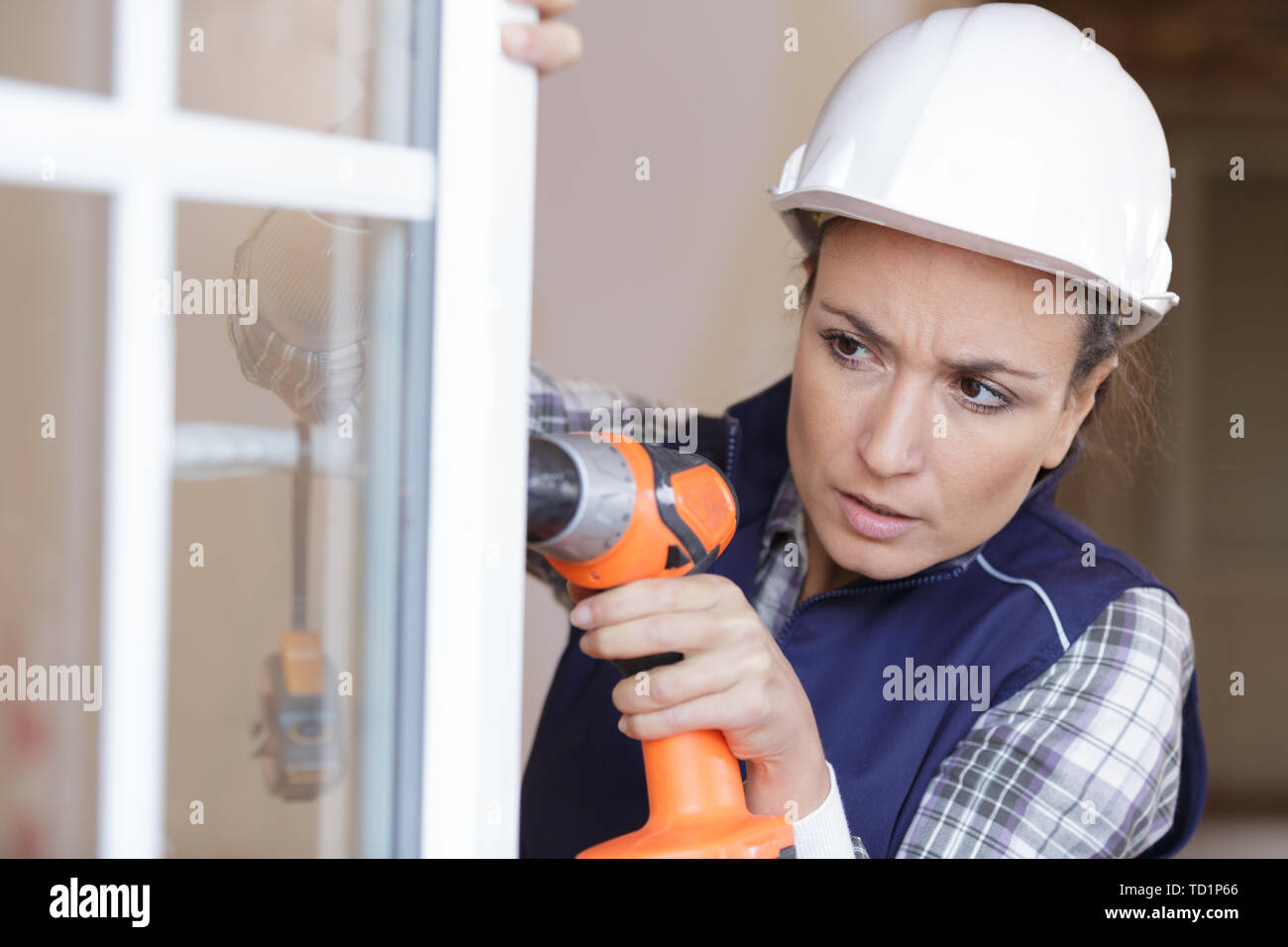 drilling a window frame Stock Photo - Alamy