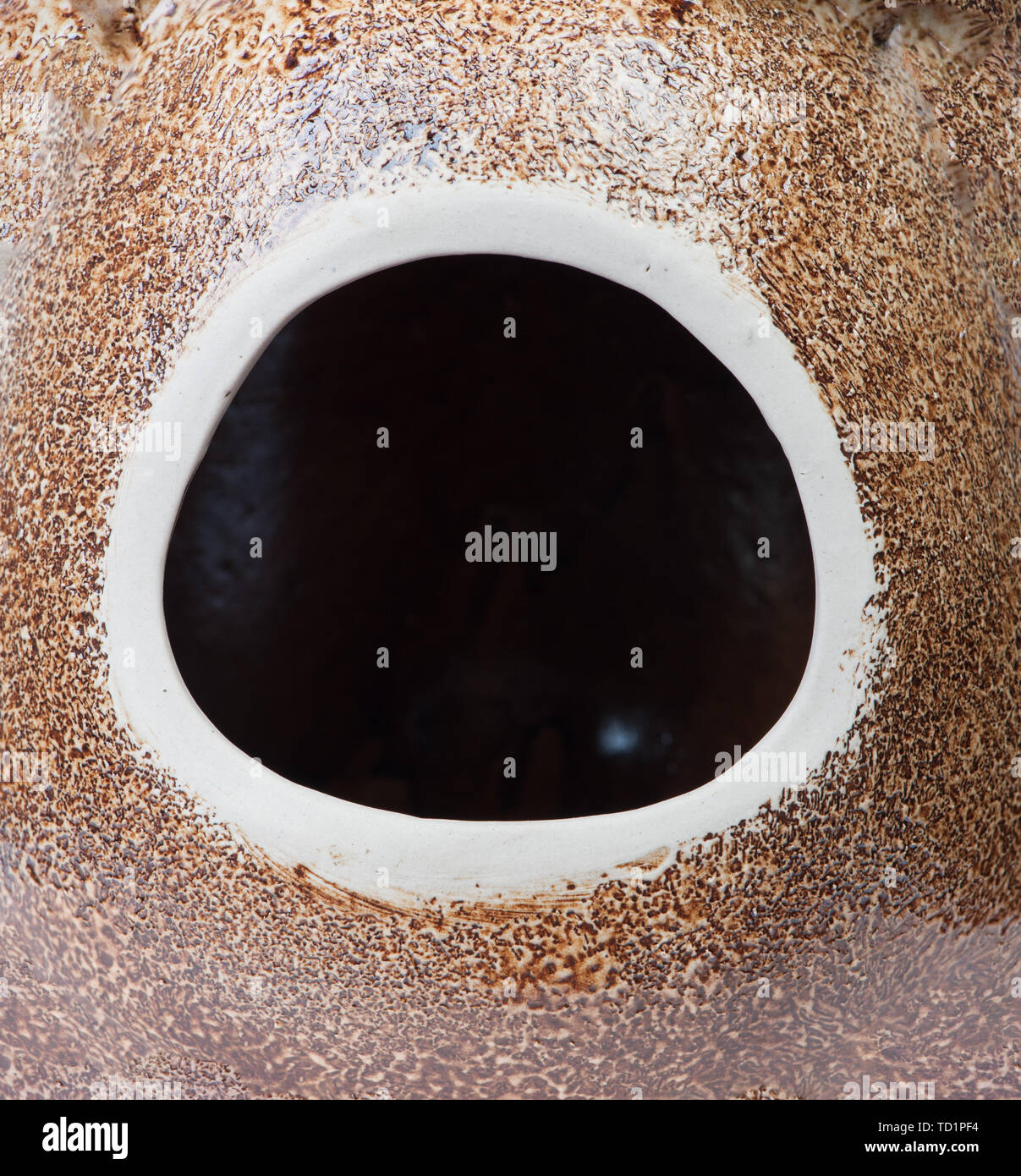 Hole in the ceramic background Stock Photo - Alamy