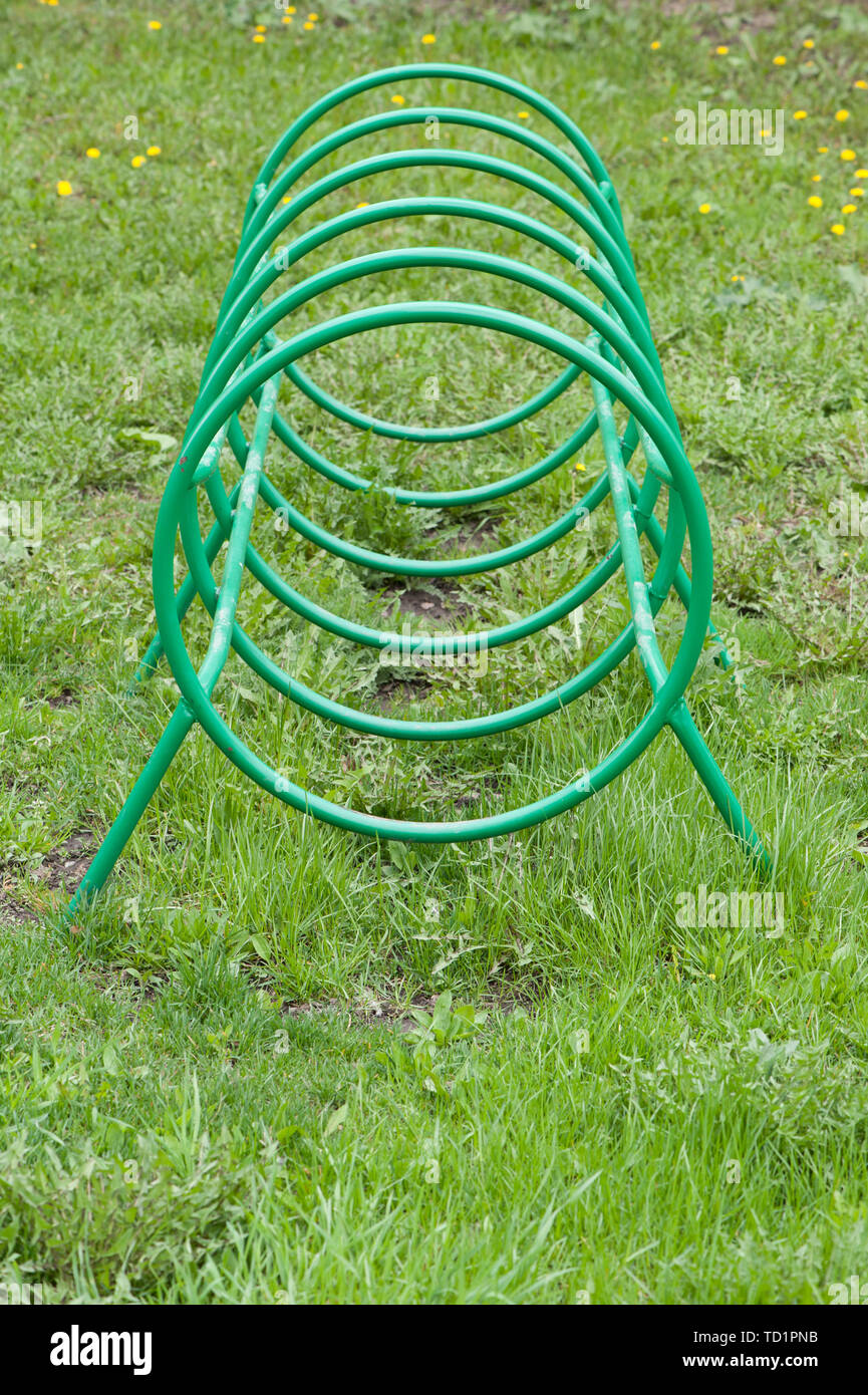 Ring metal tunnel in the playground Stock Photo - Alamy