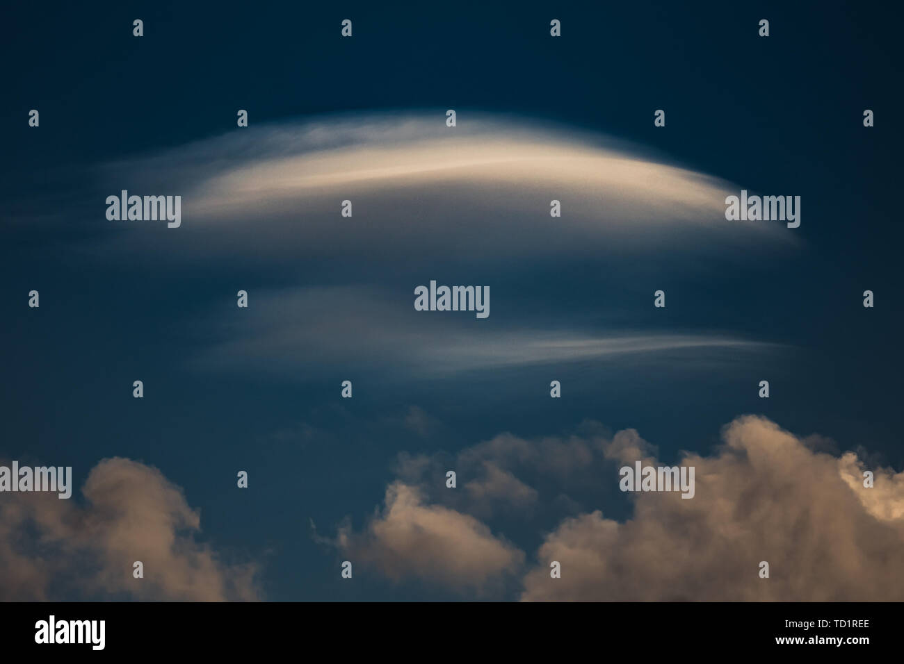 Rare Lenticular cloud Altocumulus lenticularis on top of a cumulus ...