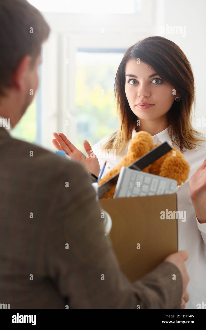 The boss holds out box with things fired bad Stock Photo - Alamy