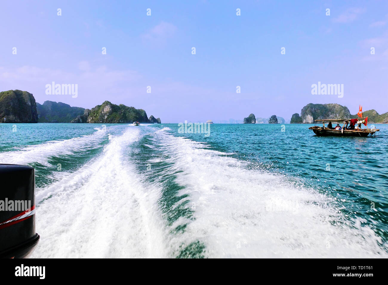 Behind the fast moving boat on the water surface,Vietnam's halong bay ...