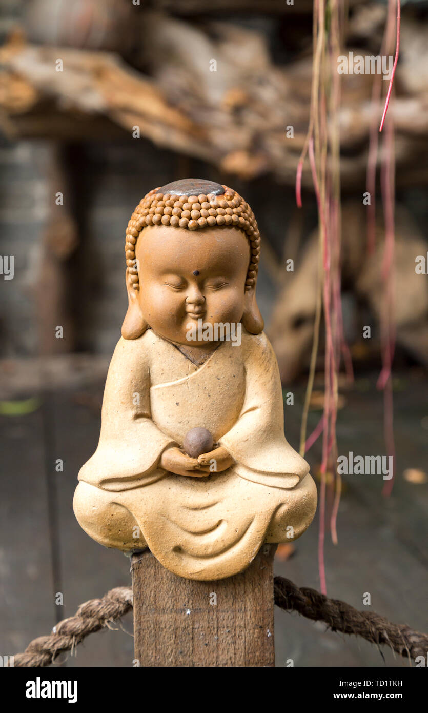 Little monk statue Stock Photo - Alamy