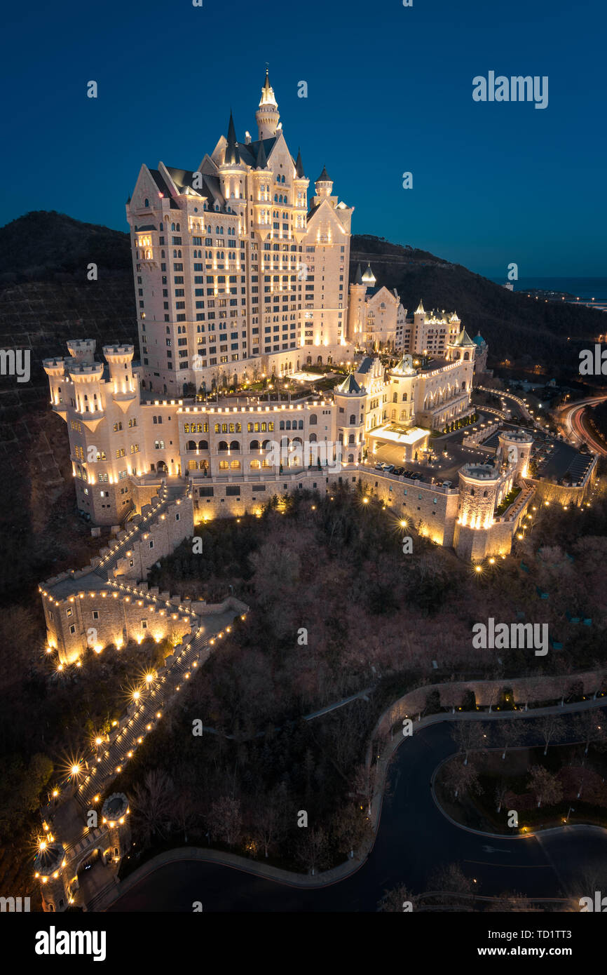 One side castle hotel in Dalian Stock Photo - Alamy