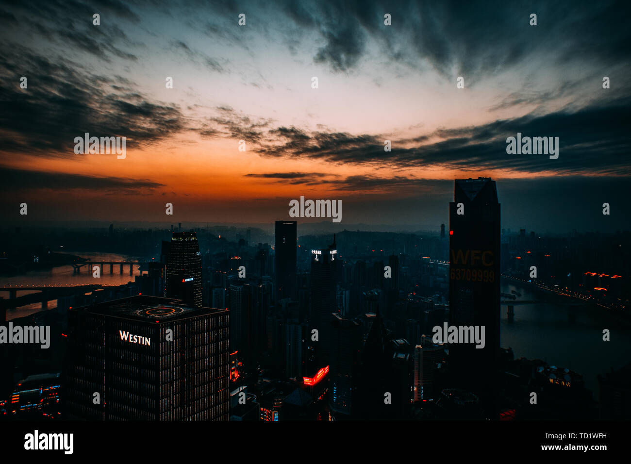 On the top of the city, standing in Chongqing United International ...