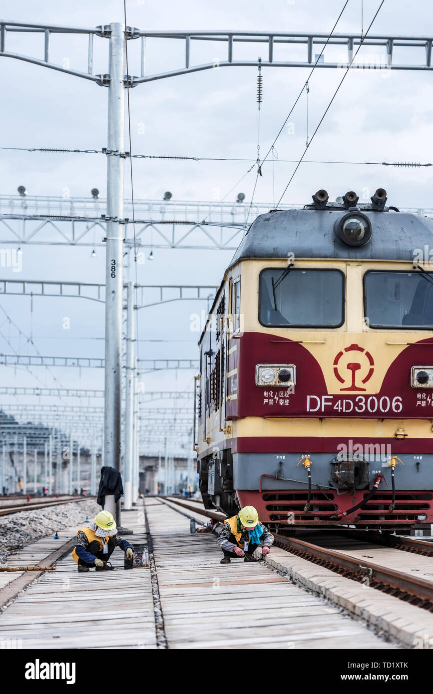 Railway workers maintain high-speed rail tracks in Kunming, southwest ...