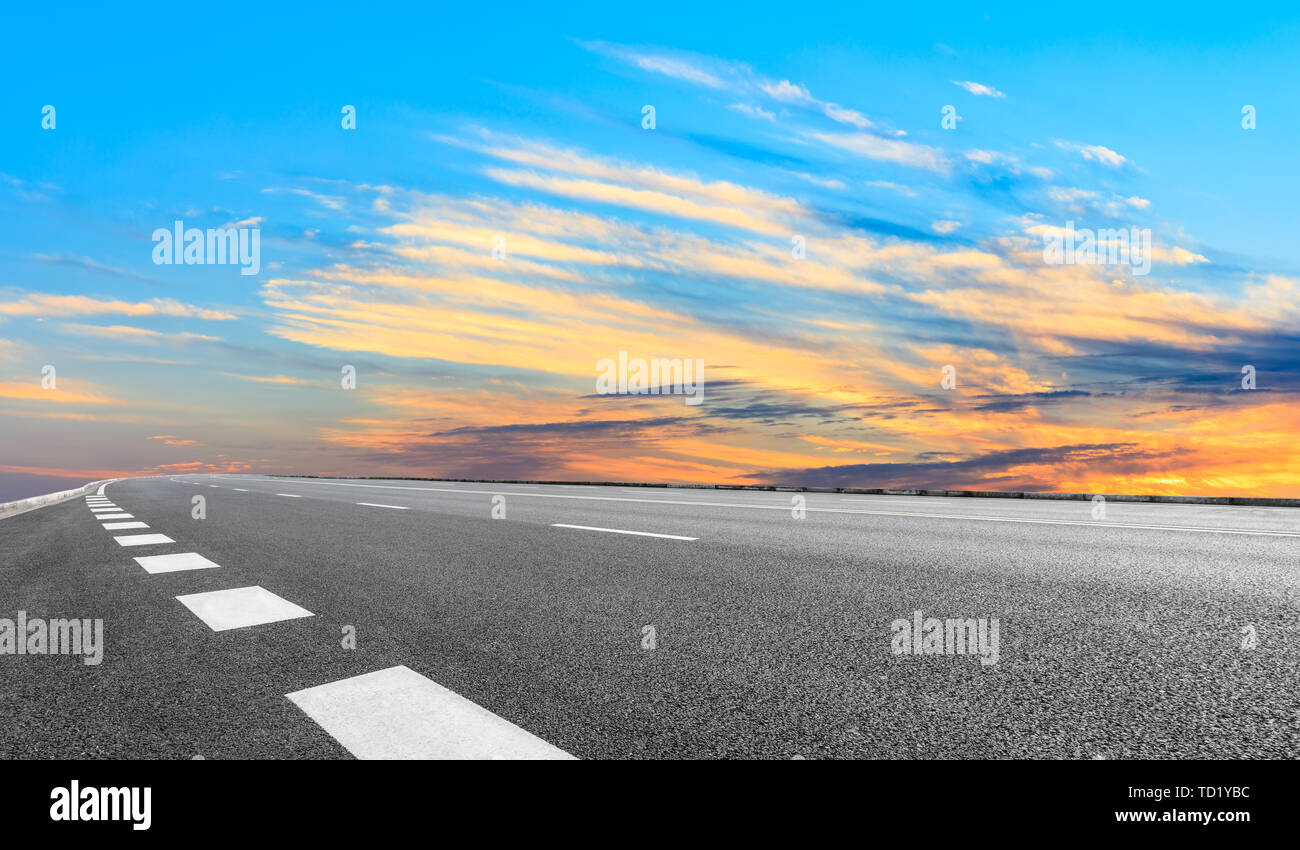 Asphalt road and sunset sky,panoramic view Stock Photo - Alamy